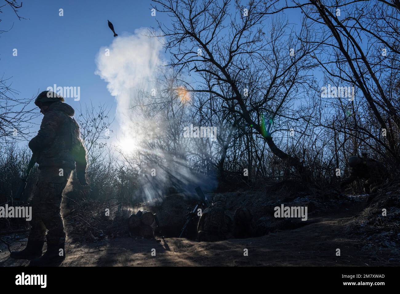 Ukrainian servicemen fire a 120 mm mortar towards Russian positions at ...