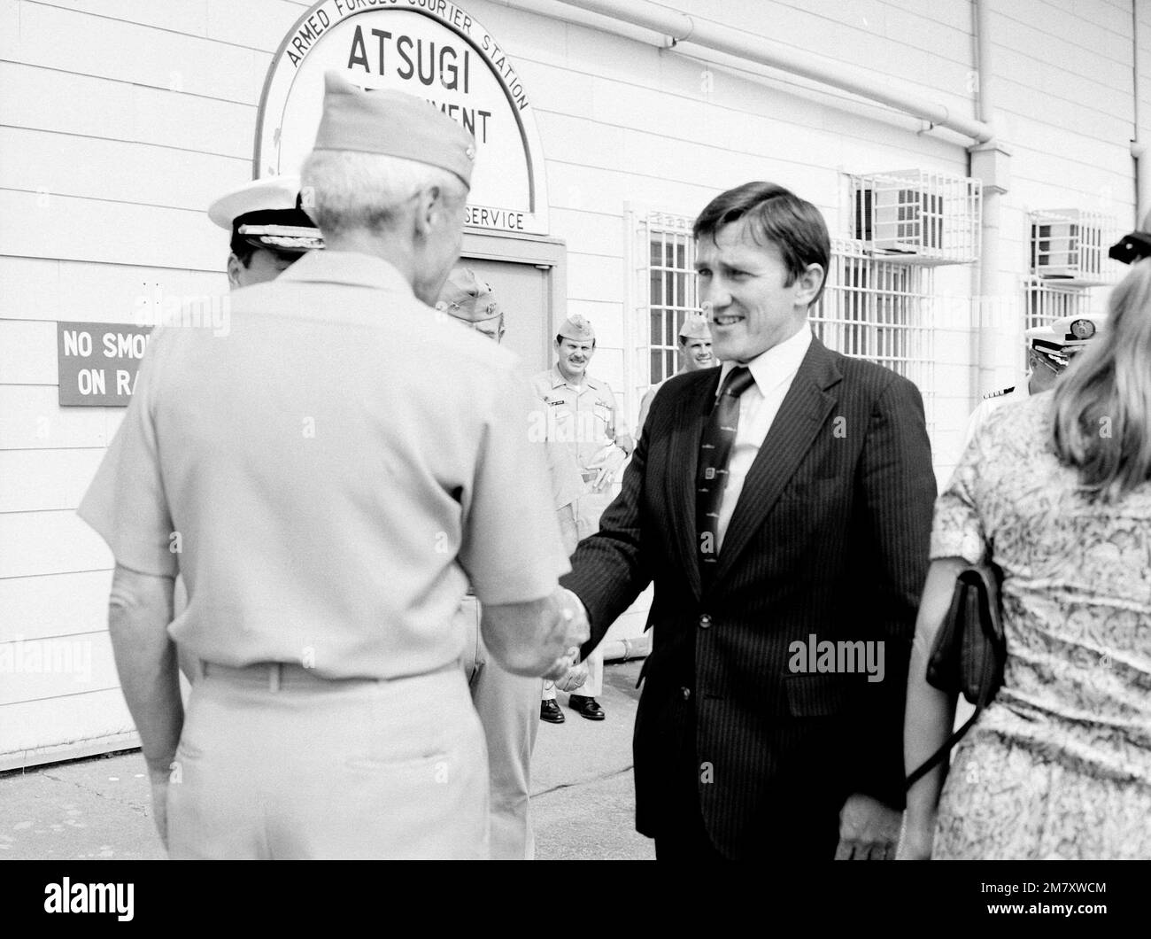Secretary of the Navy John F. Lehman Jr. is welcomed aboard by Admiral ...
