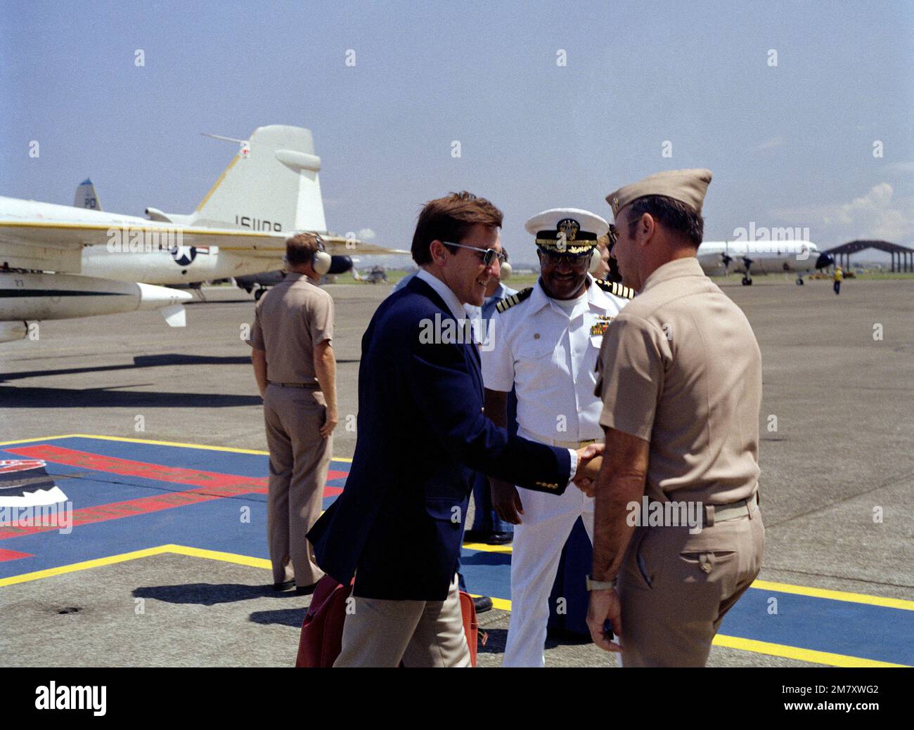 Secretary of the Navy John F. Lehman Jr. is greeted by Rear Admiral ...