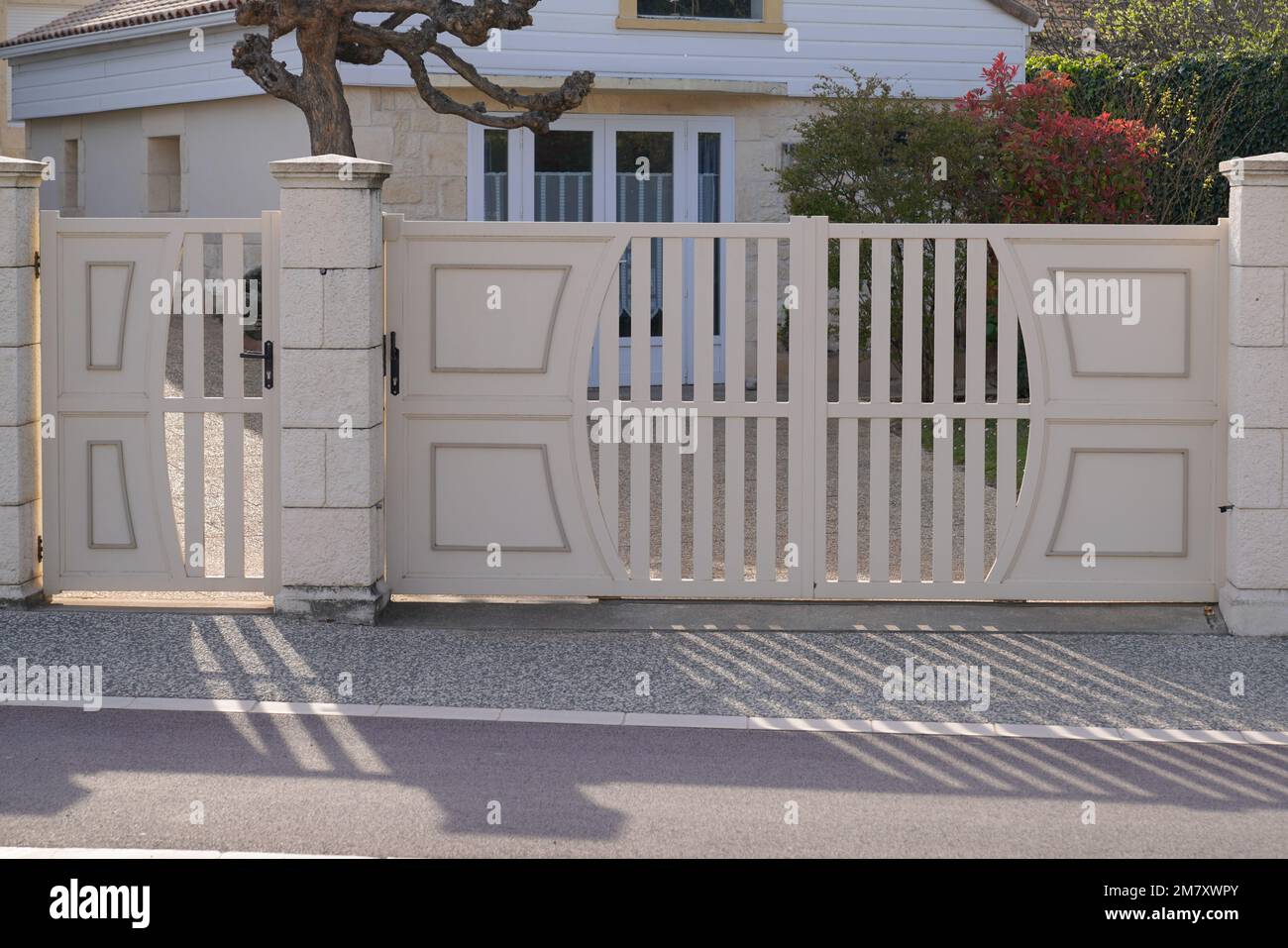Aluminum large beige car gate of modern house door access in street ...