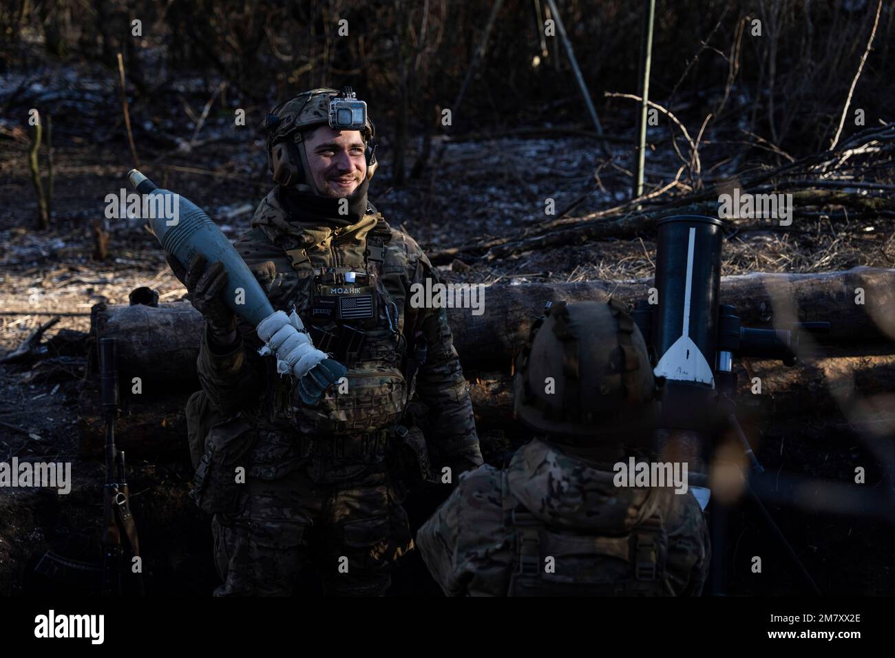 Ukrainian servicemen prepare to fire a 120 mm mortar towards Russian ...