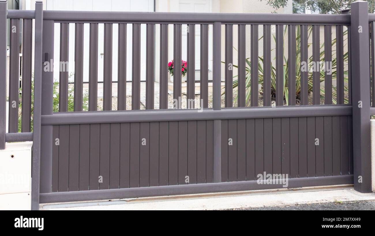 Aluminum large grey car gate of modern house in street view Stock Photo ...