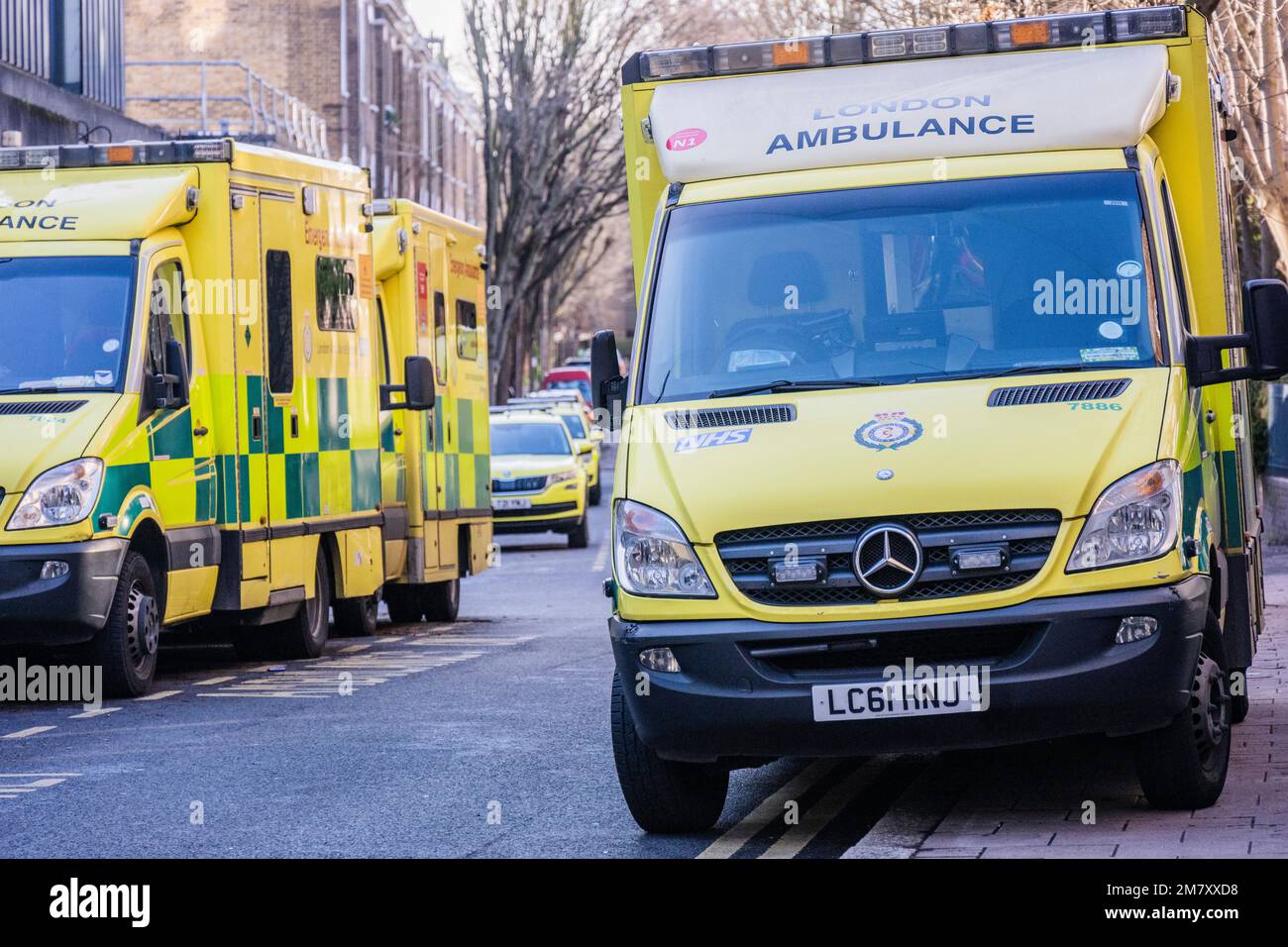 London, UK. 11th Jan, 2023. Ambulances wait idle around the back - A ...