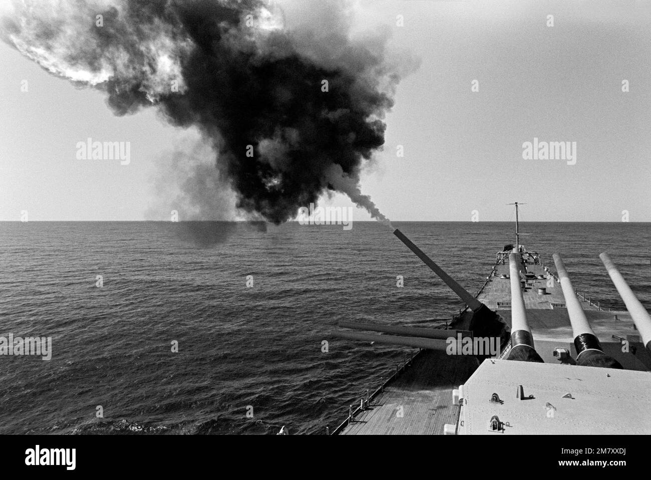 A close-up view of the 16-inch/50-caliber guns being fired aboard the ...