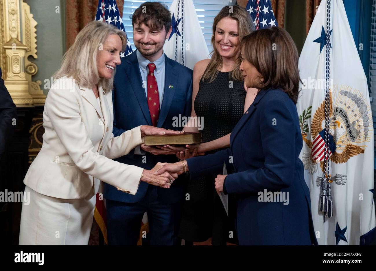 United States Vice President Kamala Harris shakes hands with US ...
