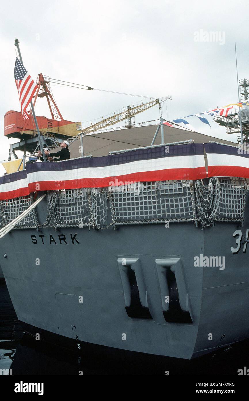 Crewmen aboard the guided missile frigate USS STARK (FFG-31) raise a ...