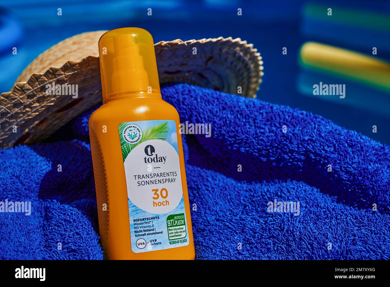 Berlin, Germany - July 24, 2022: Anti-sunburn spray on a blue towel by ...