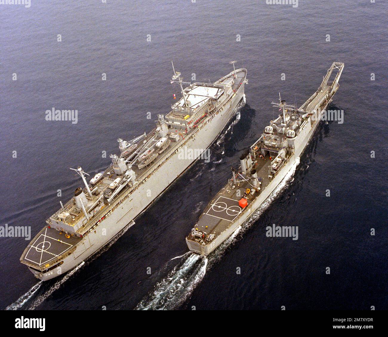 An elevated starboard quarter view of the destroyer tender USS ACADIA ...