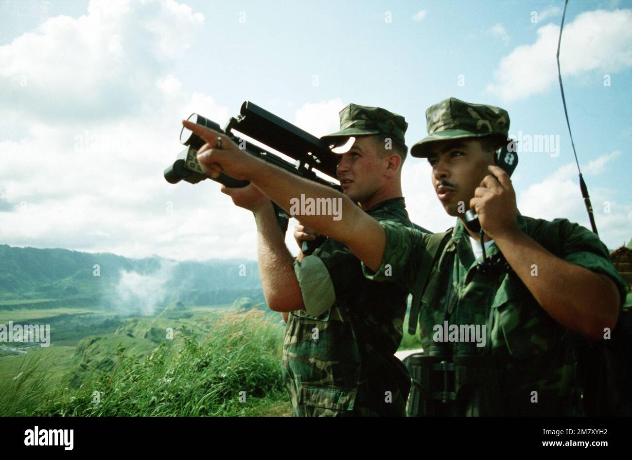 A US Marine aims a shoulder-fired Redeye anti-aircraft rocket while his ...