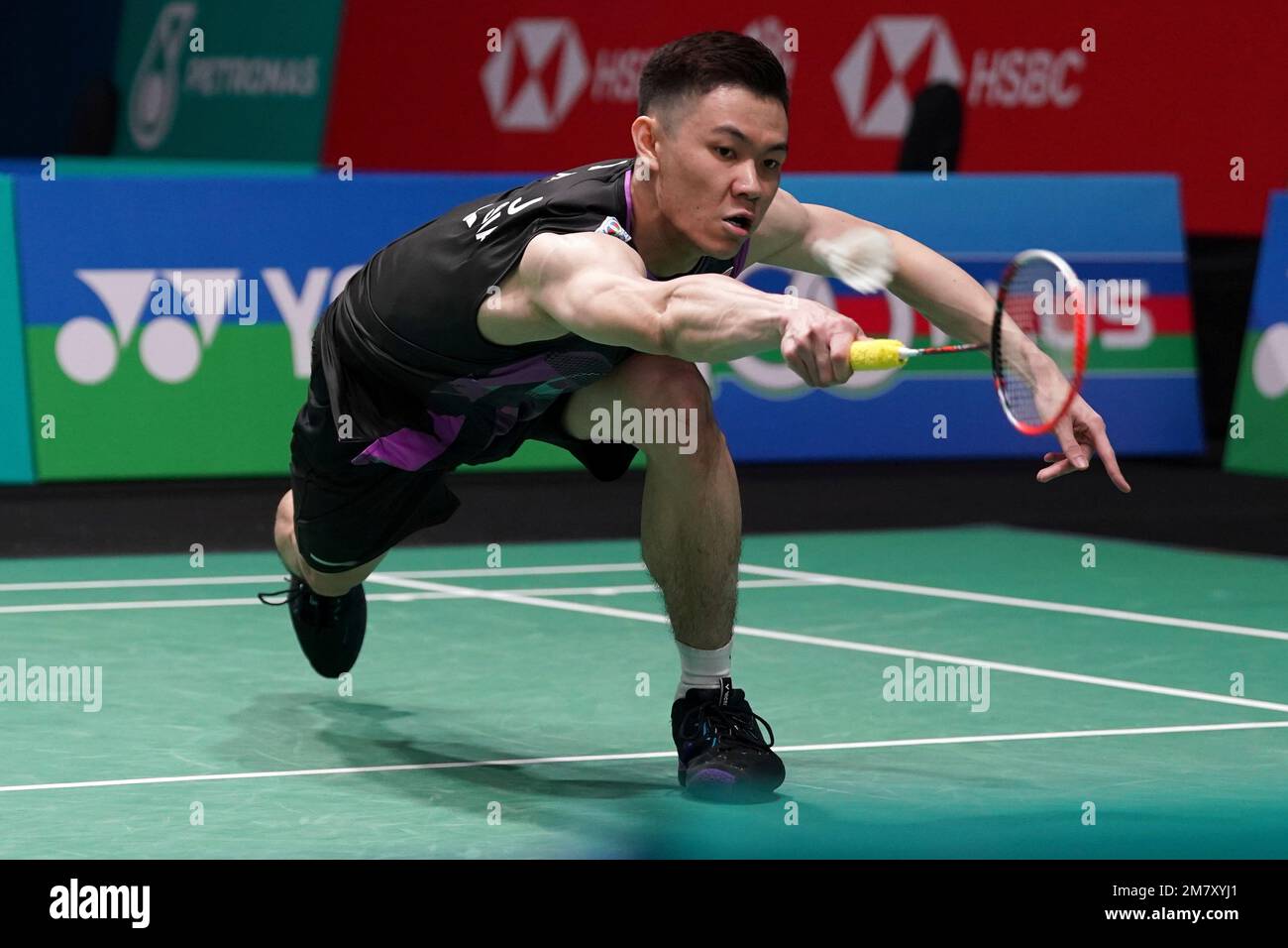Malaysia's Lee Zii Jia plays a shot against Japan's Kodai Naraoka during their men's singles ...