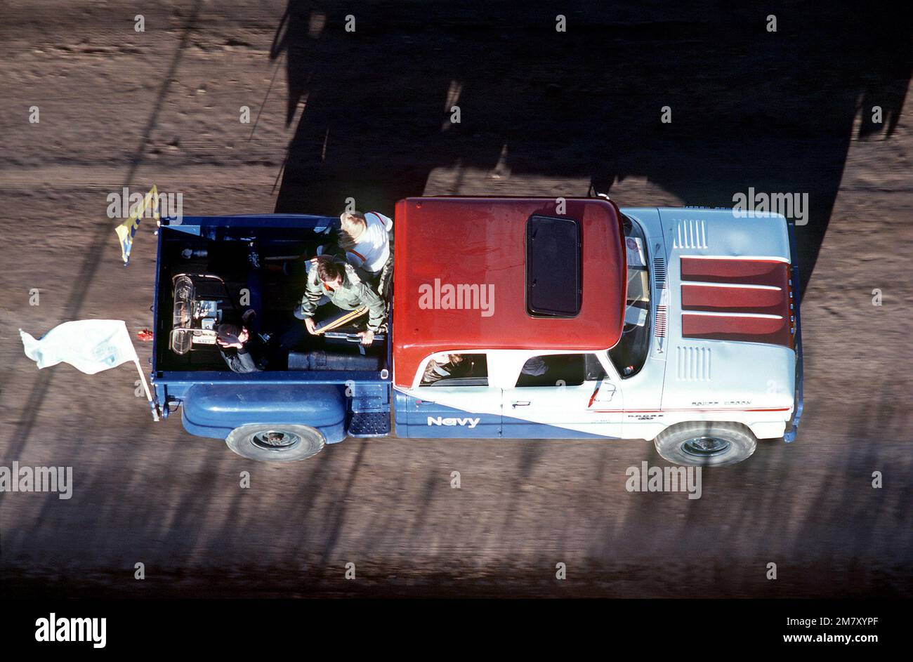 An aerial view of team members in the back of the pickup truck used to ...
