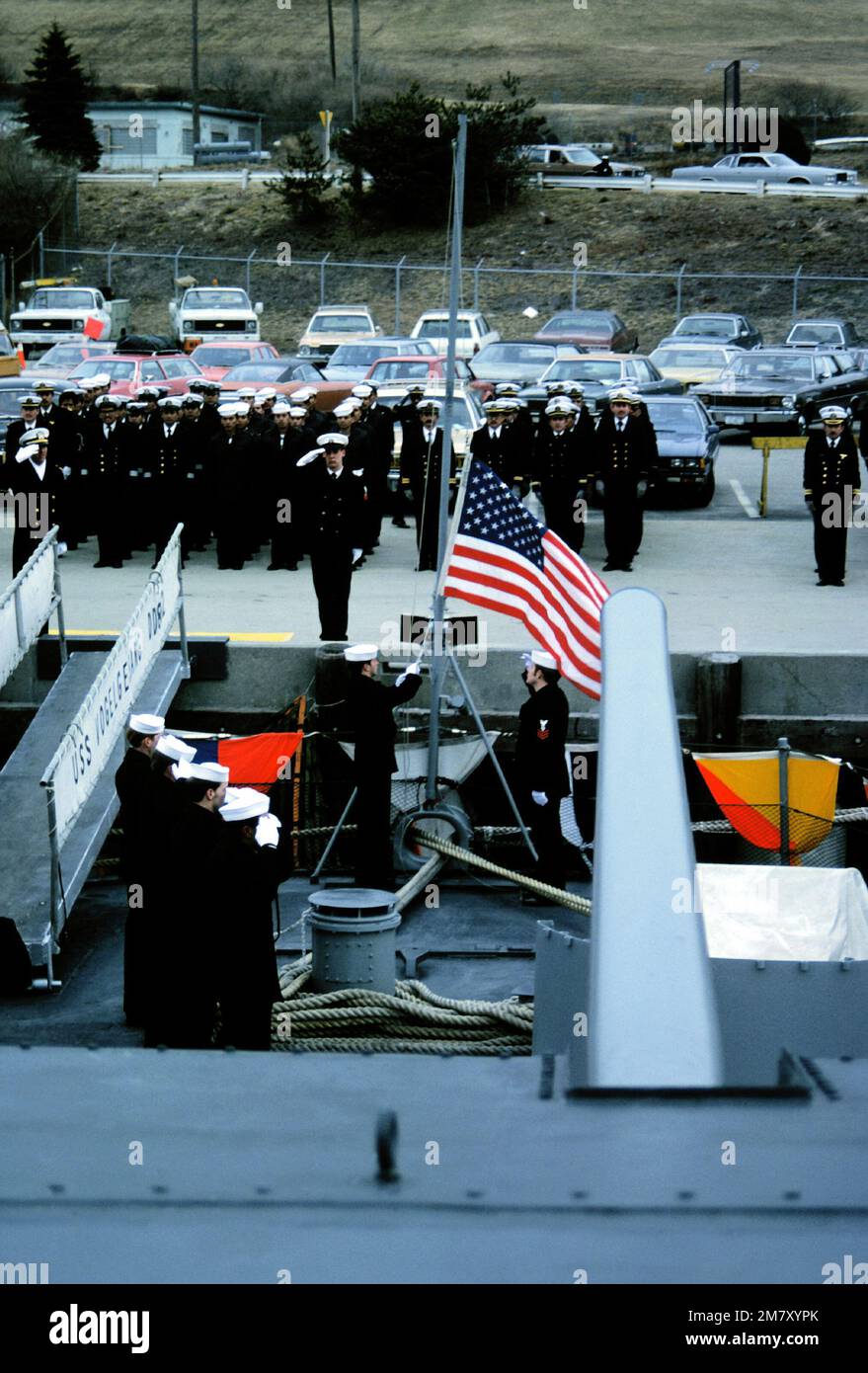 The colors are lowered for the last time aboard the destroyer USS ...