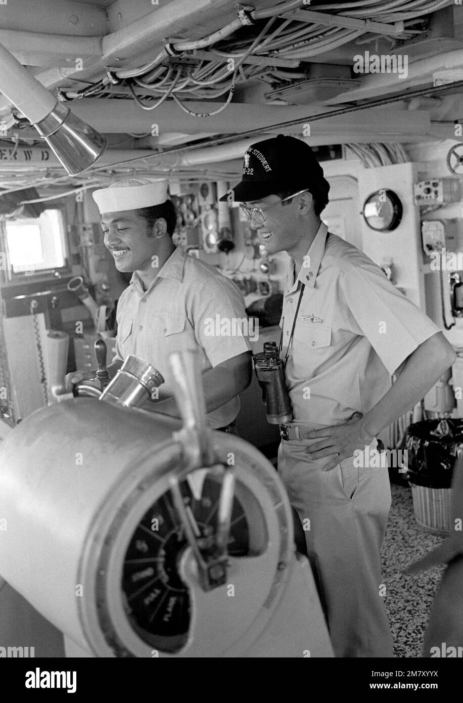 Lieutenant Daniel W. Chang, who is stationed aboard the guided missile ...