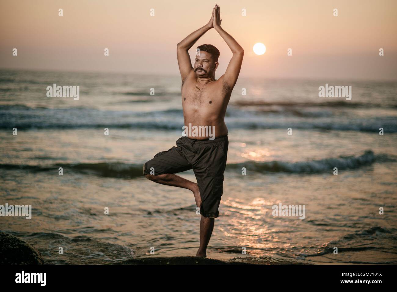 Indian male model standing with one leg hi-res stock photography and ...