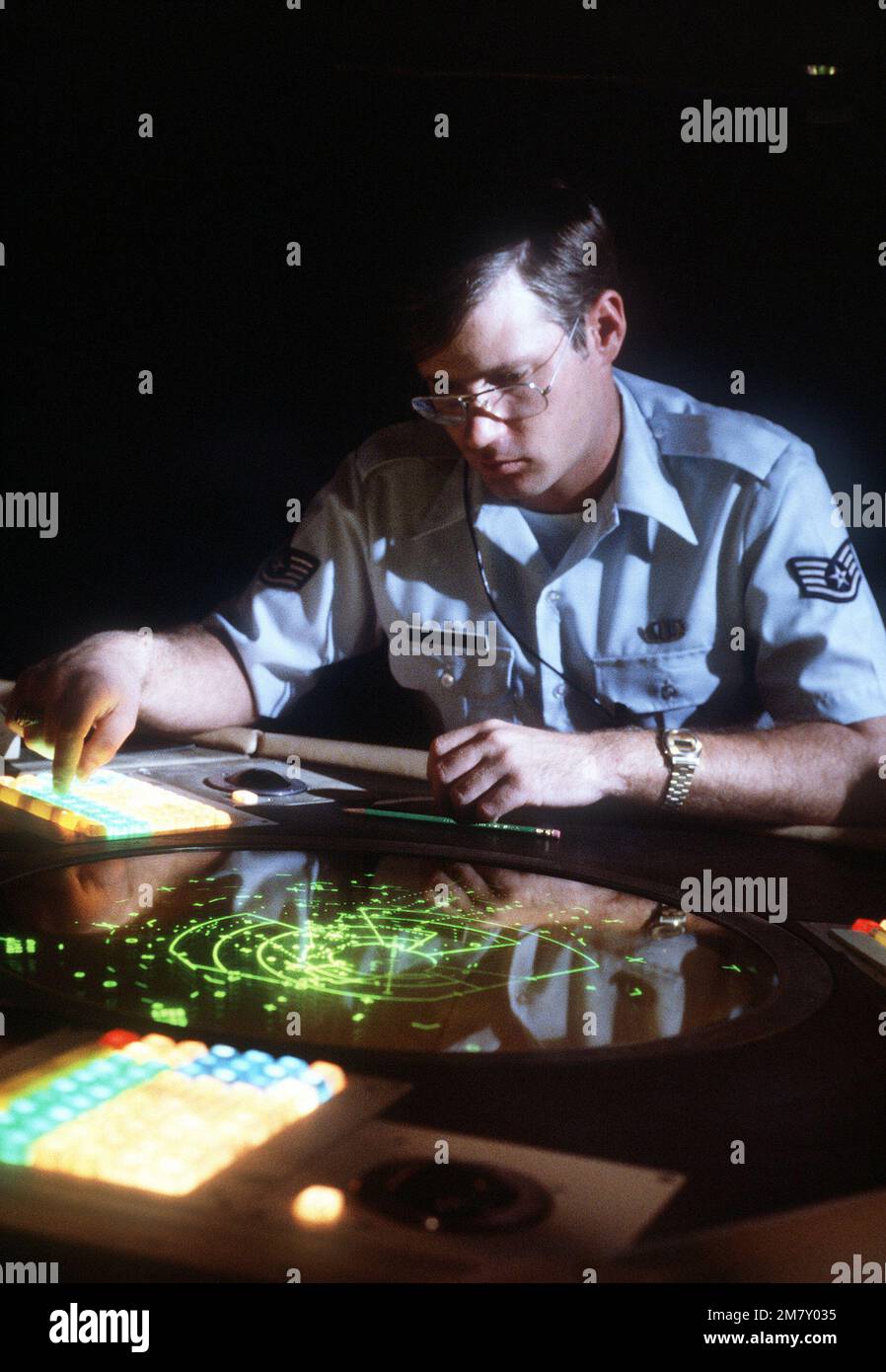SSGT Michael Pate, an air traffic controller, monitors a radar ...