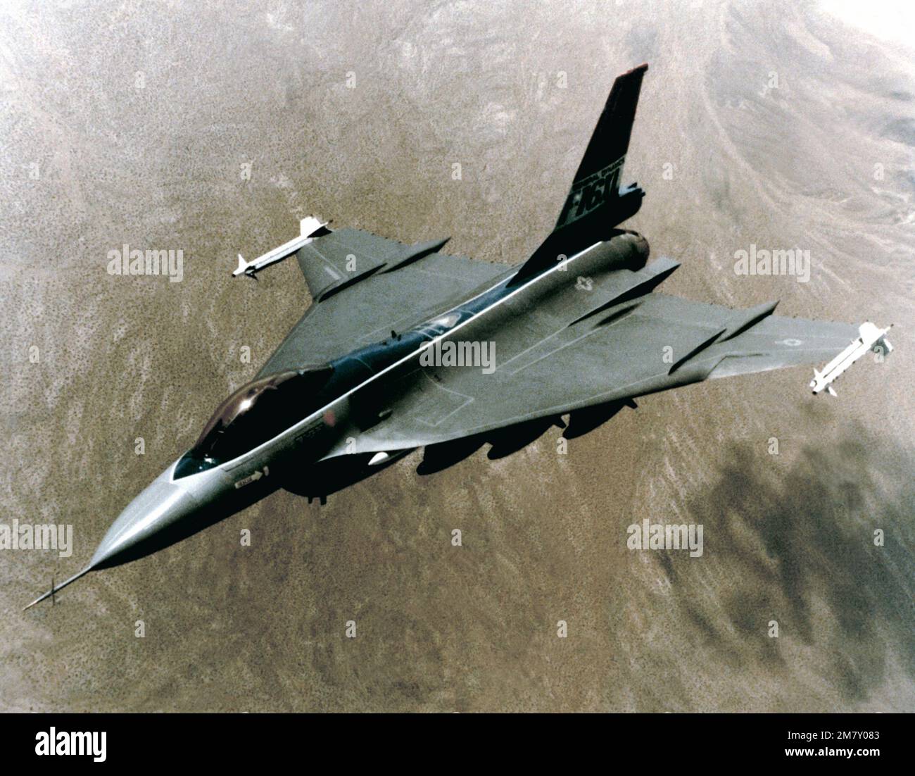An air-to-air left front view of the prototype F-16XL Fighting Falcon ...