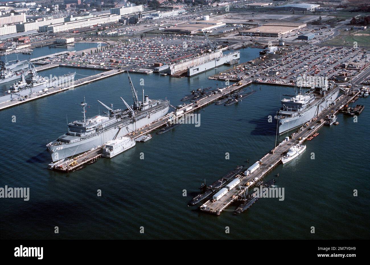 Aerial view of the submarine tenders USS EMORY S. LAND (AS-39) and USS ...