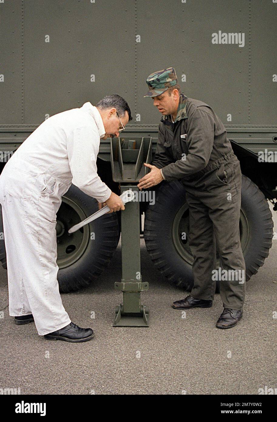 Jacks are placed under the XM-971E1 semi-trailer van prior to being ...