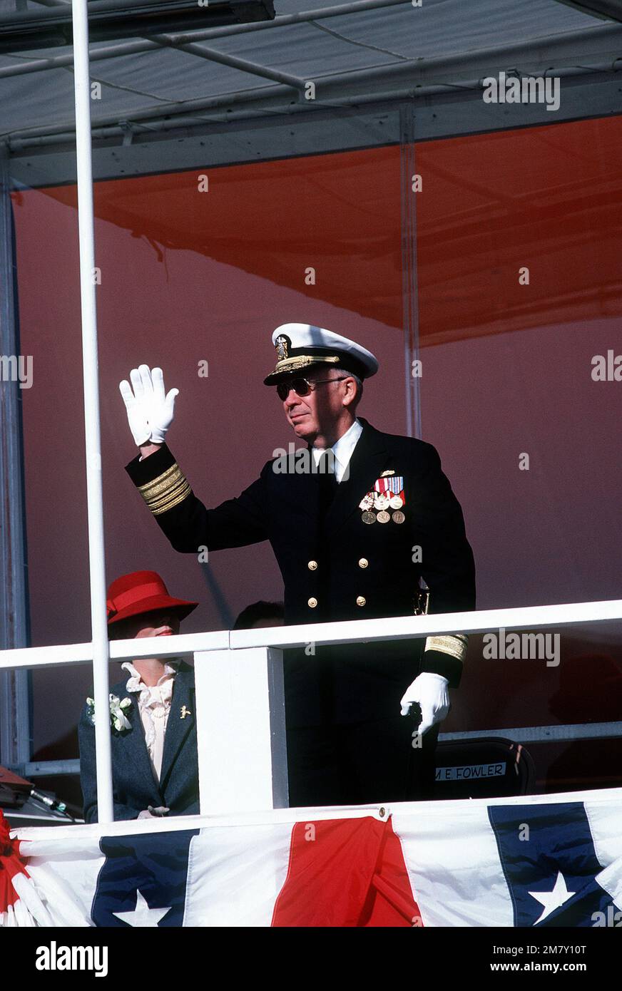 Chaplain (Capt.) James W. Conte stands and waves to the crowd during ...