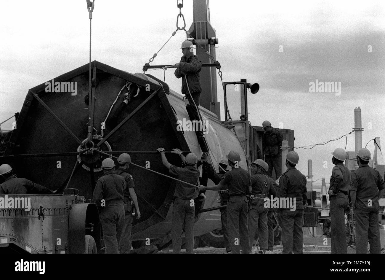 Members of the 390th Missile Maintenance Squadron prepare stage one of ...