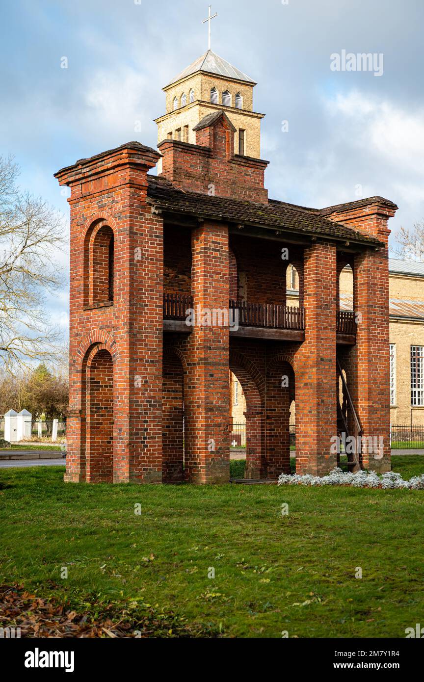 Old Catholic Church and red brick gates in city Akniste, Latvia ...
