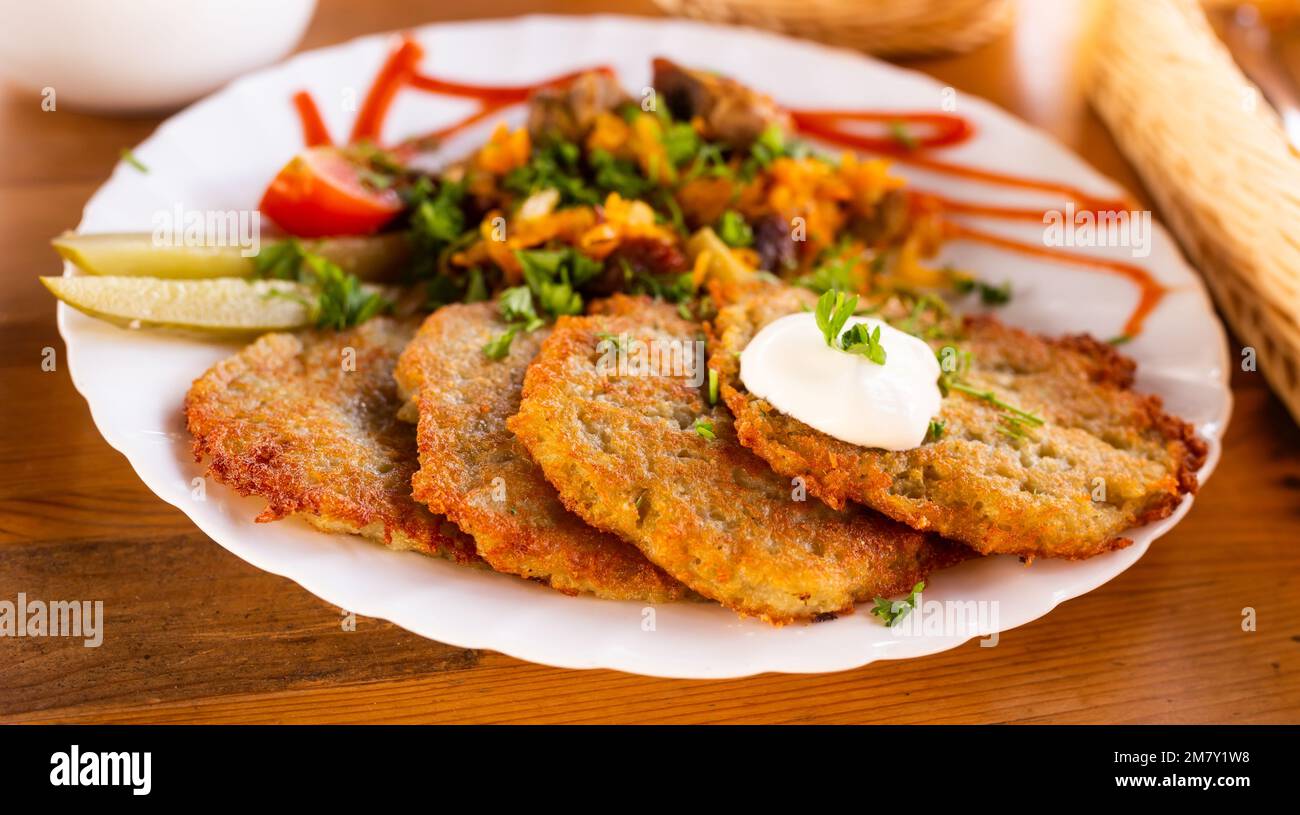 belarusian draniki with grilled beef dish in a restaurant Stock Photo ...