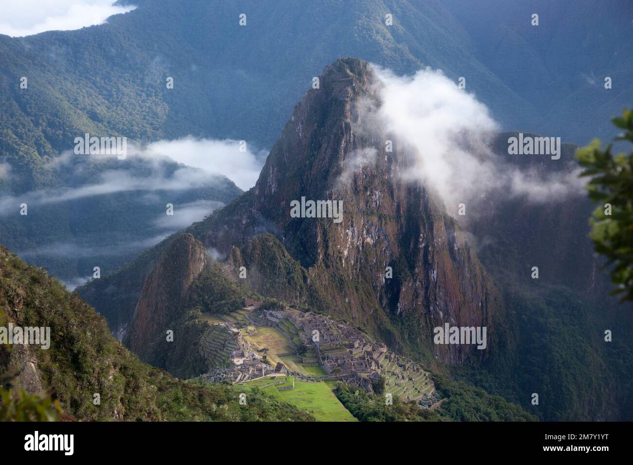 Spiritual morning mist rises over Inca head mountain at Machu Picchu ...