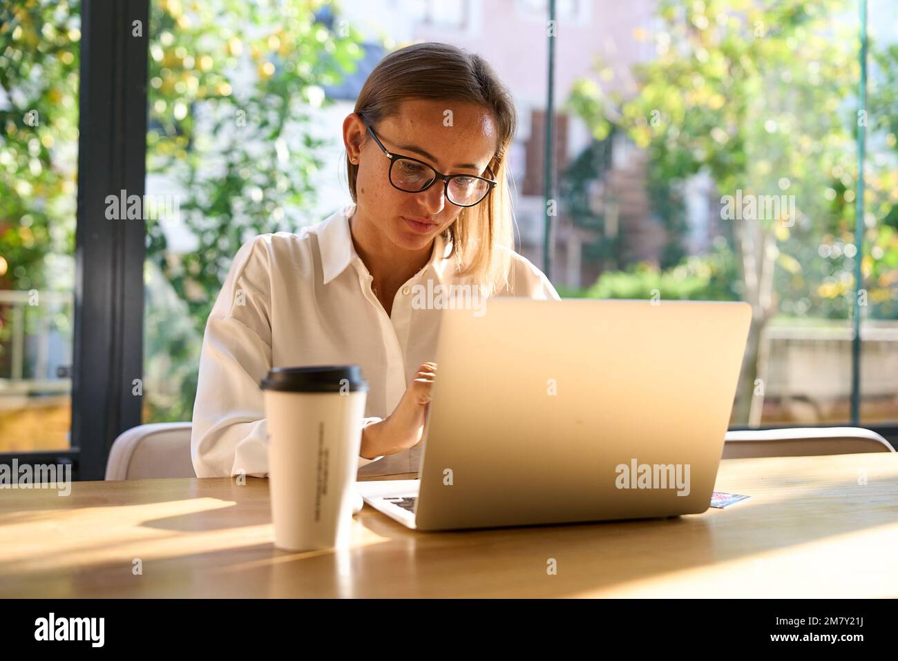 Hipster Girl use Laptop huge Loft Studio.Student Researching Process ...