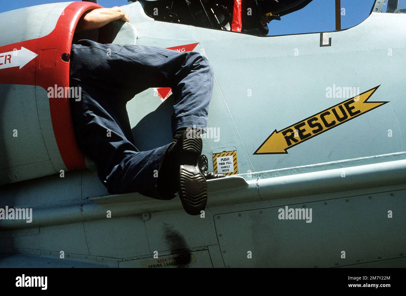 A Royal Australian Air Force member checks a United States Navy A-4 ...