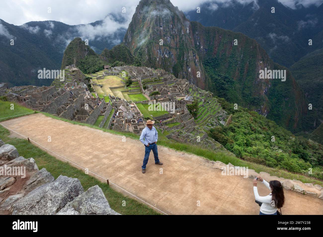 Machupichu, Peru-June 04, 2015: A women take a picture in Machu Picchu ...