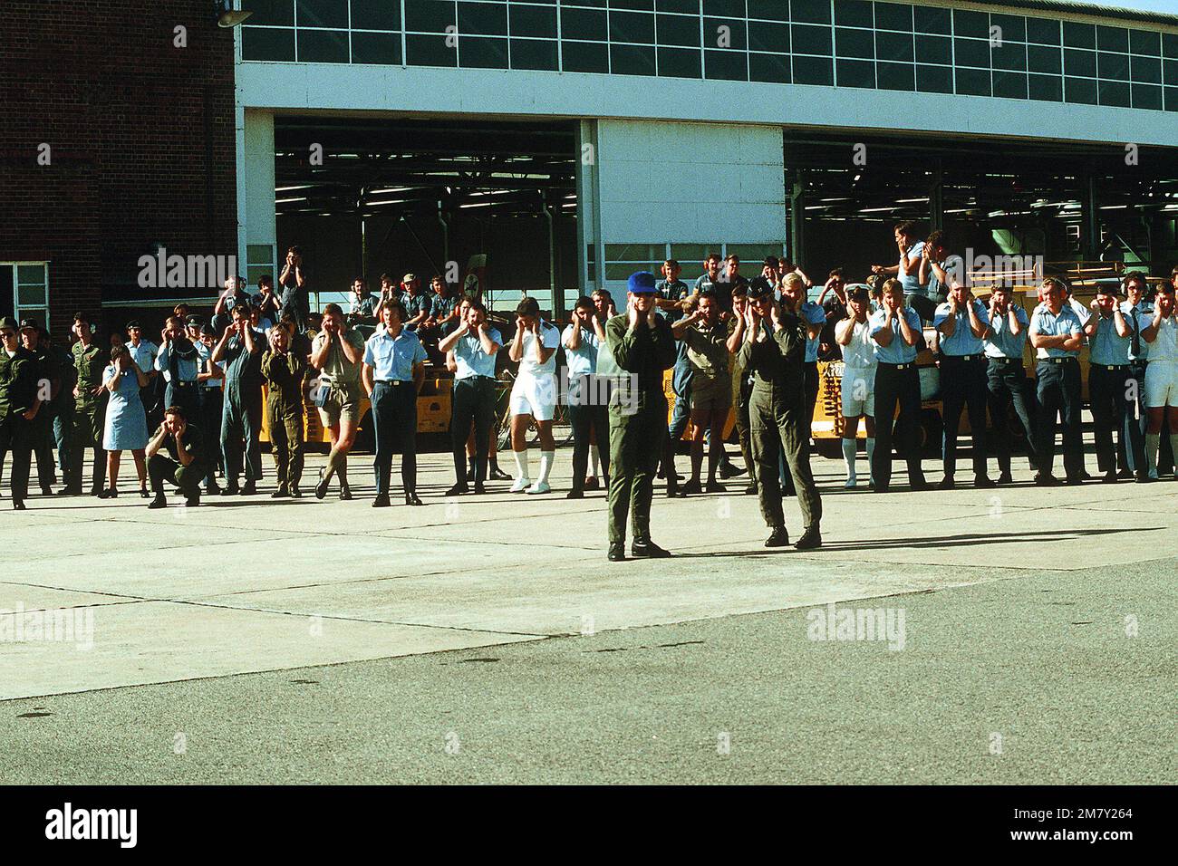 Royal Australian Air Force members take their breaks from work to watch ...