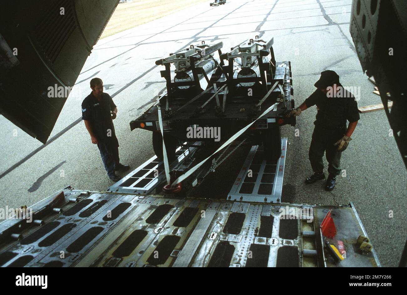 AGM-65B Maverick Scene Magnification missiles are being loaded aboard a ...