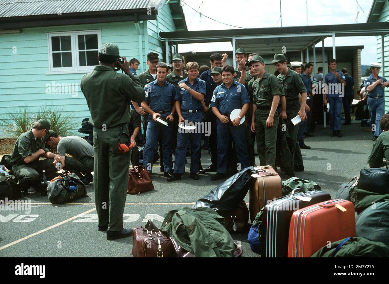 United States Air Force and Navy members pose for a photograph during ...