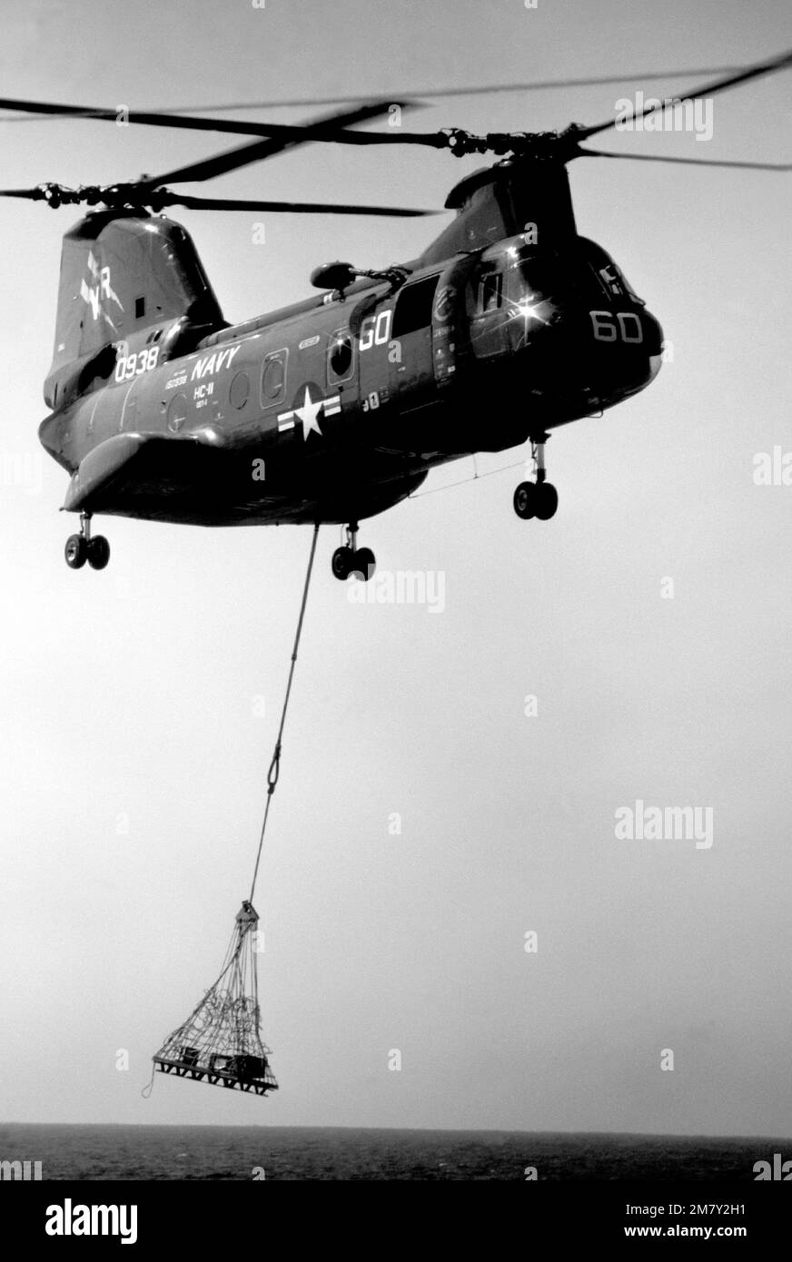 A CH-46 Sea Knight helicopter brings supplies to the ammunition ship ...