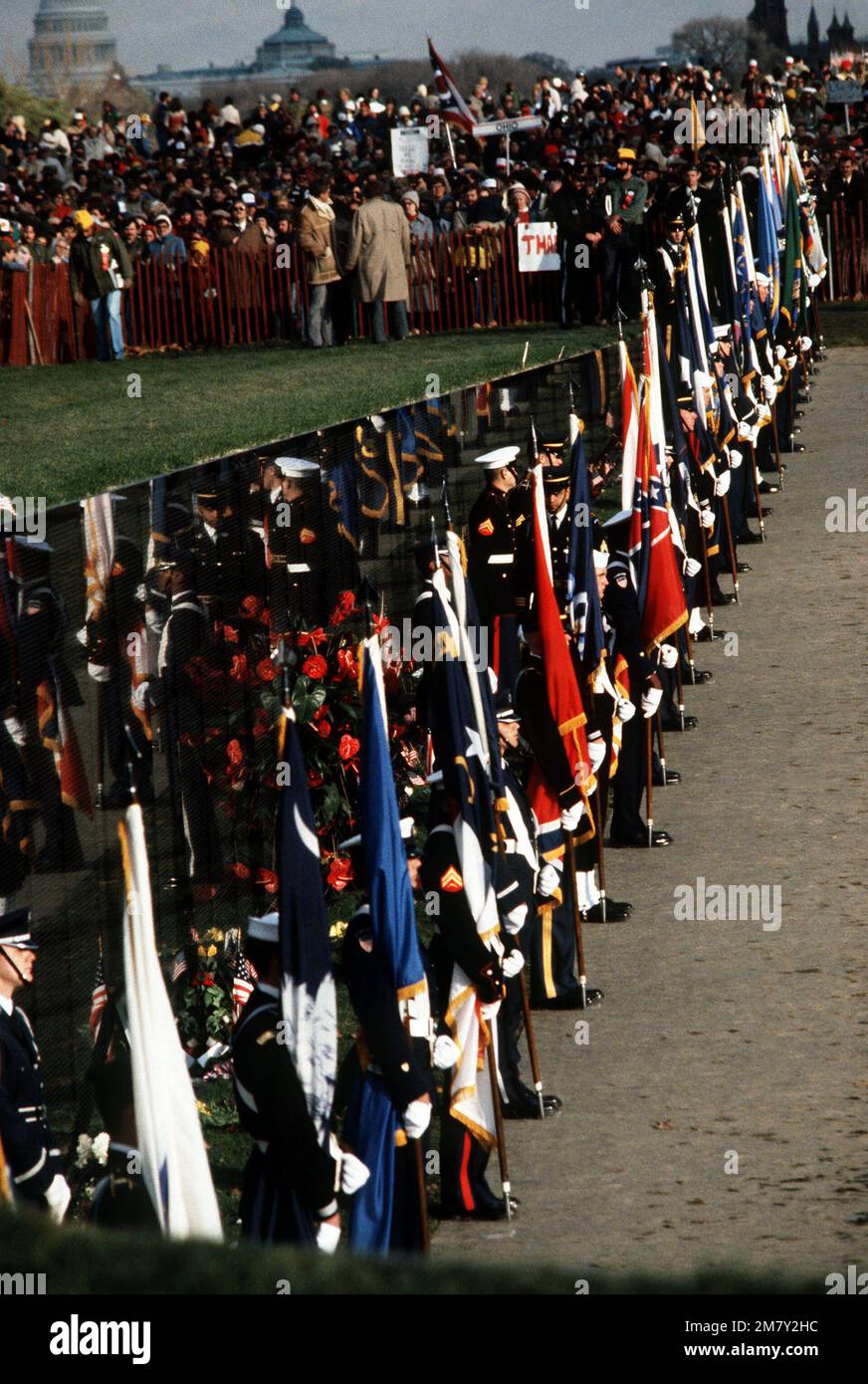 A joint services color guard displays state flags during the dedication ...