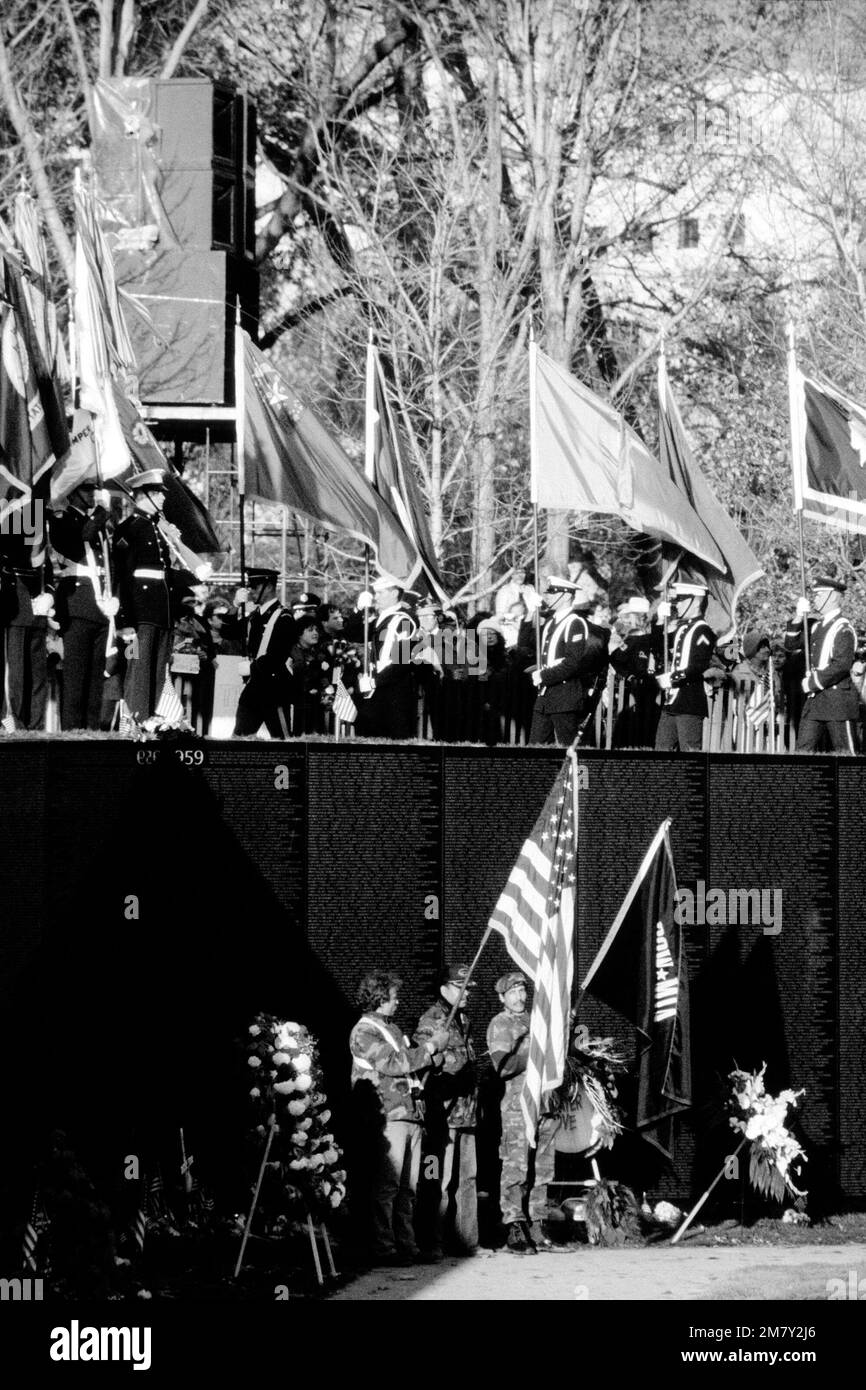 A joint services color guard displays state flags during the dedication ...