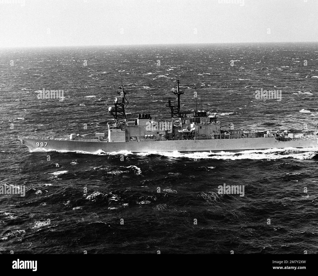 Aerial port beam view of the destroyer USS HAYLER (DD 997) underway ...