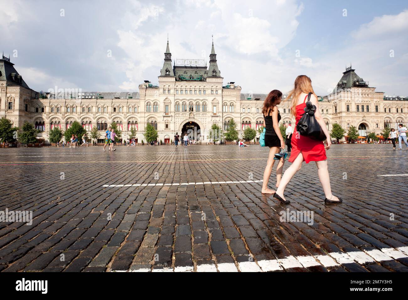 wo girls walk through the Red Square in front of the GUM Stock Photo ...