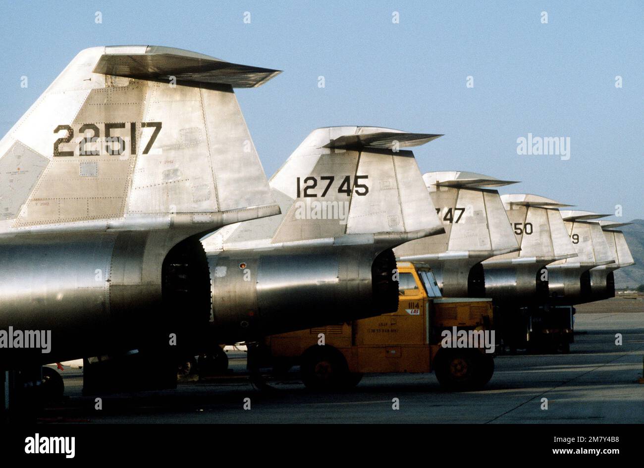 A left side view of the tail sections of several F-104G Starfighter ...
