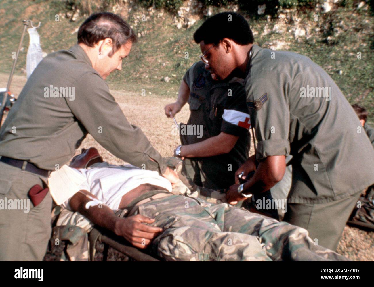 Personnel from the Kadena Medical Clinic examine a simulated casualty ...