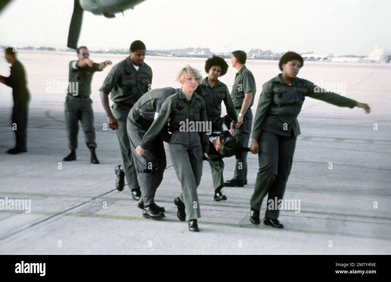 Air Force medical personnel assist simulated casualties during a mass ...