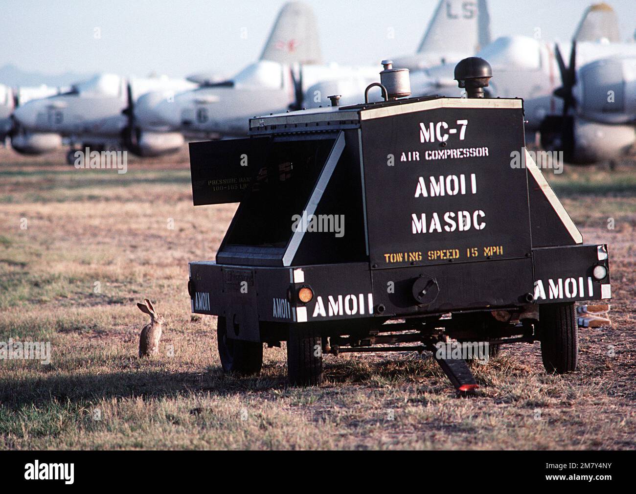 A view of an air compressor in front of the various aircraft that have ...