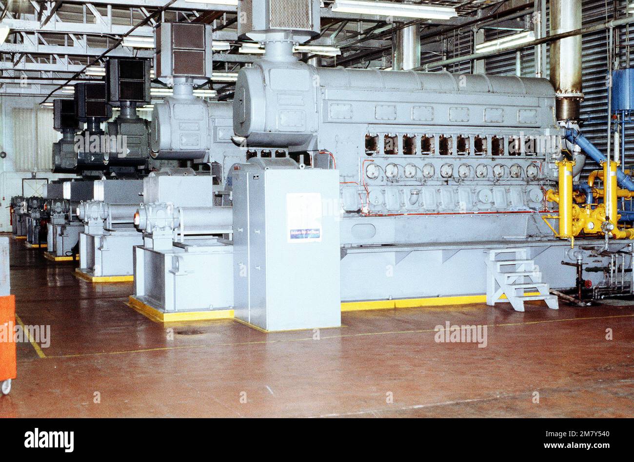 An interior view of the 10-cylinder engine generators in the main power ...
