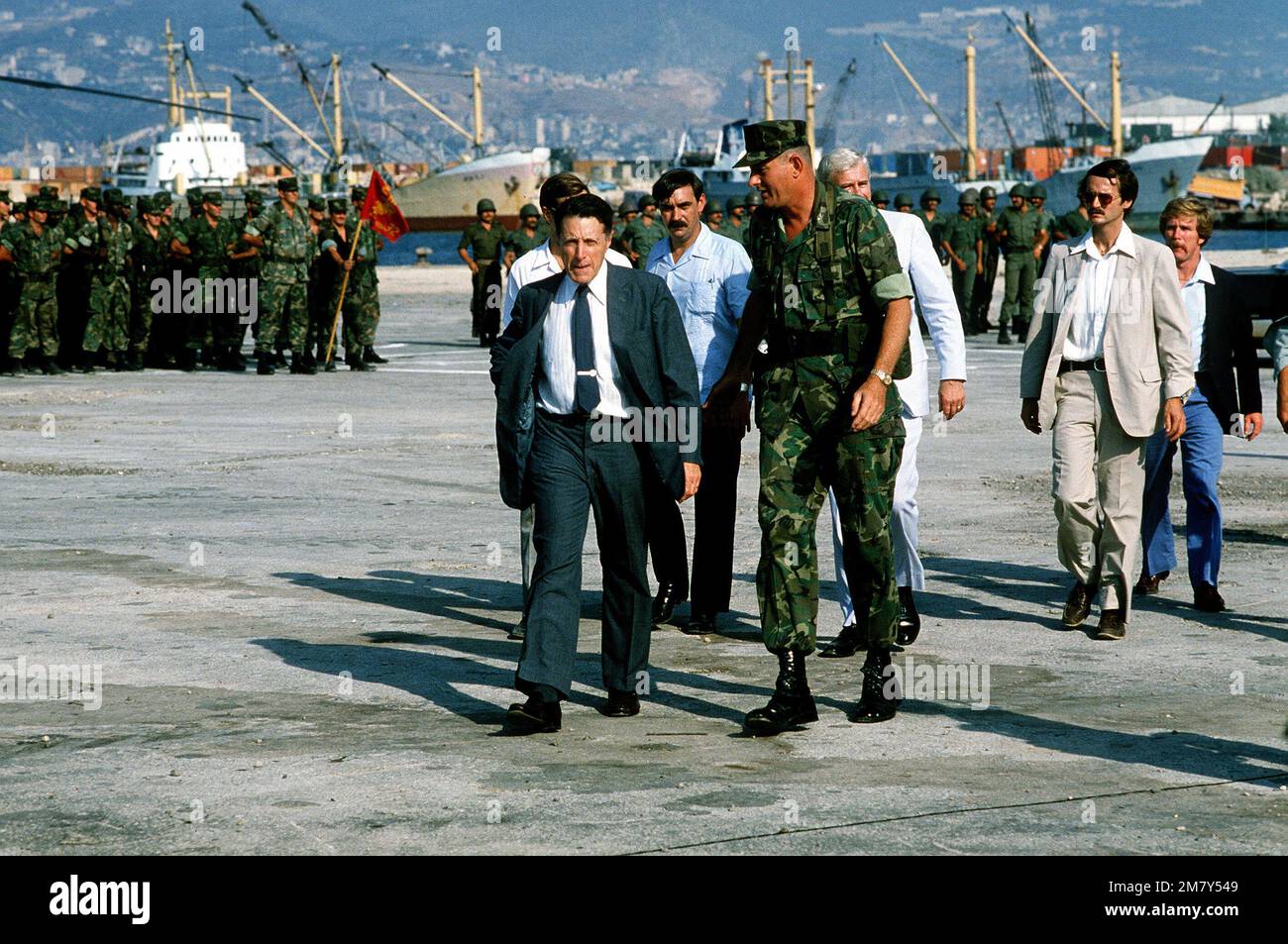 Secretary of Defense Caspar Weinberger walks with COL James M. Meade ...