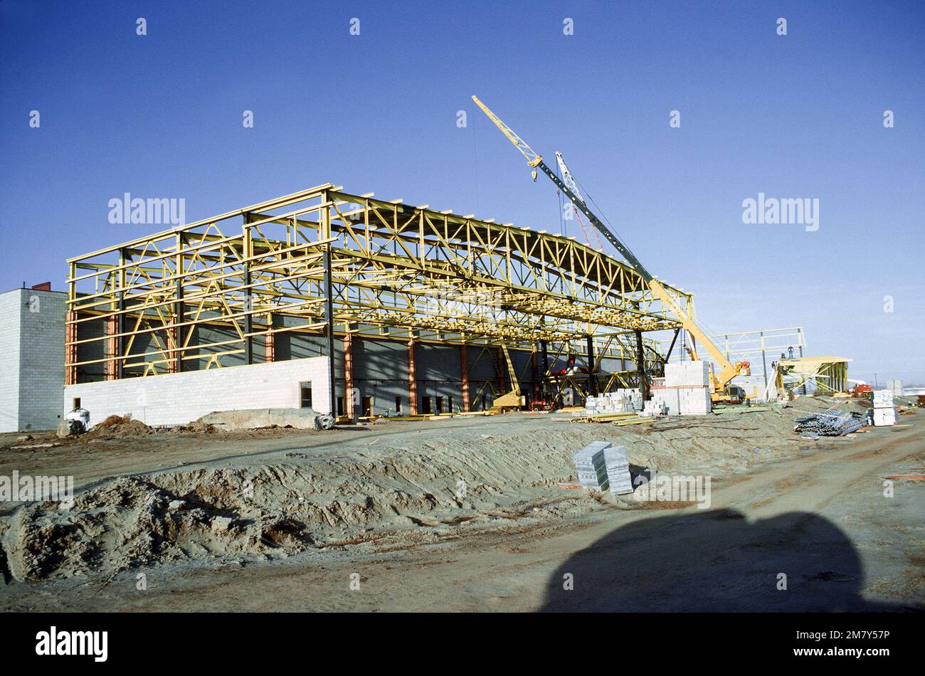 Exterior view of an F/A-18 Hornet aircraft hangar under construction ...