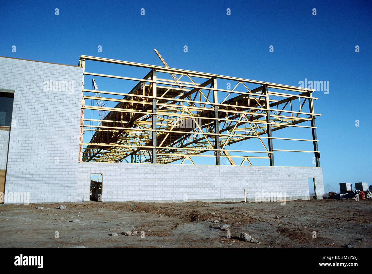 Exterior view of an F/A-18 Hornet aircraft hangar under construction ...