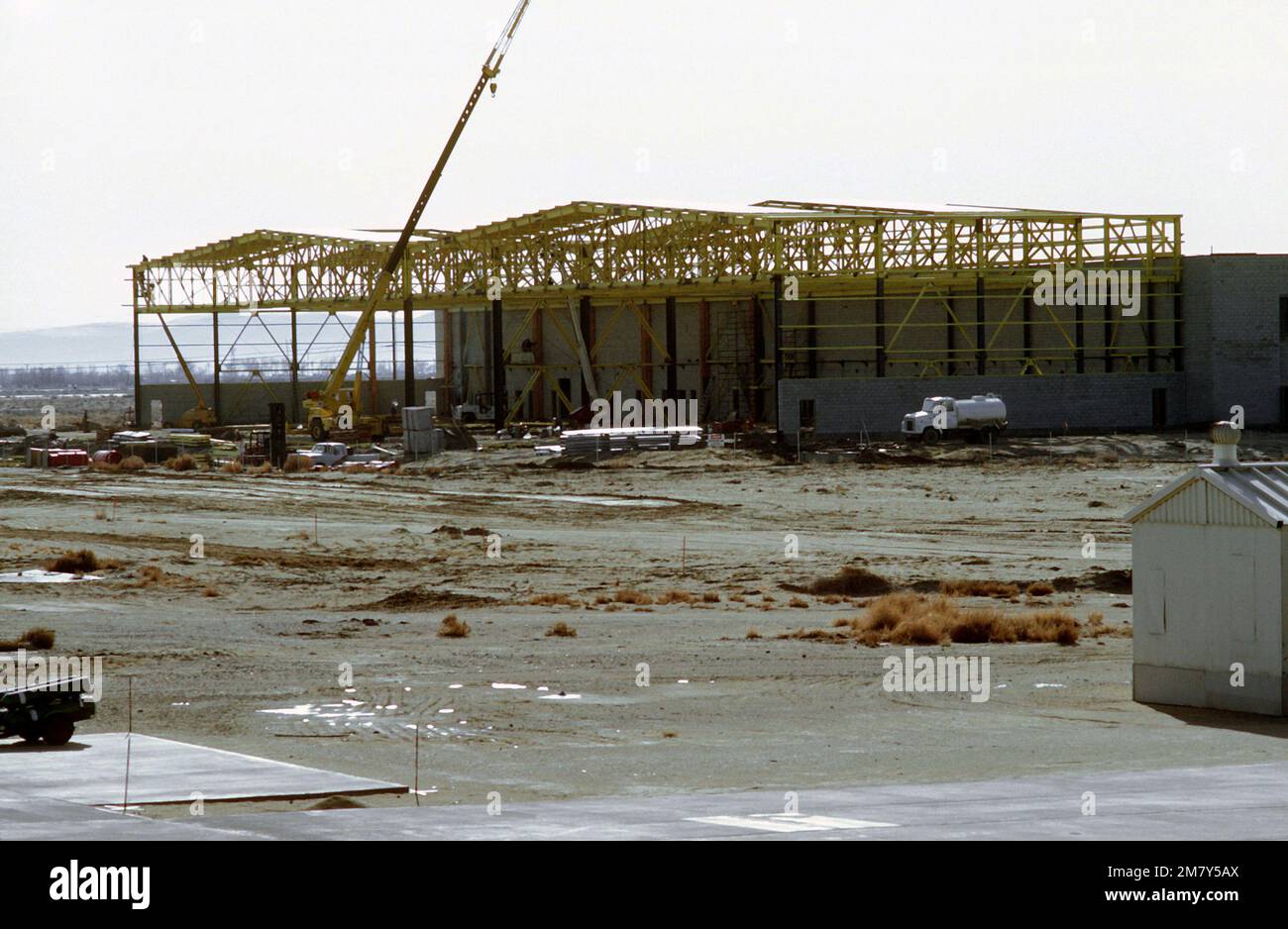 Exterior view of an F/A-18 Hornet aircraft hangar under construction ...