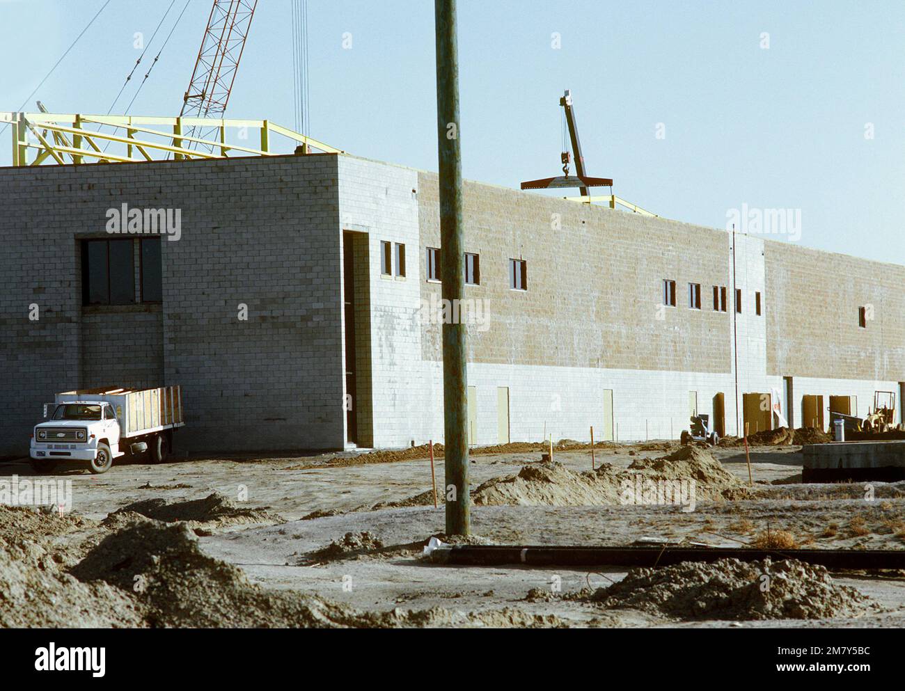 Exterior view of an F/A-18 Hornet aircraft hangar under construction ...