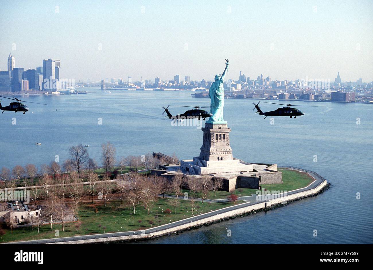 Right side view of three UH-60A Black Hawk helicopters flying near the ...