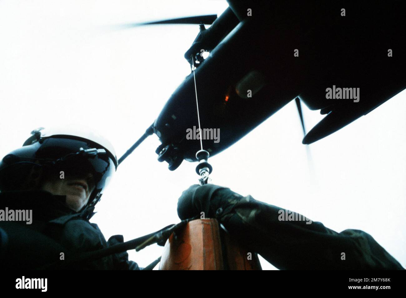 CPT Frank Gray, a "victim" of a downed aircraft, is hoisted into a HH ...